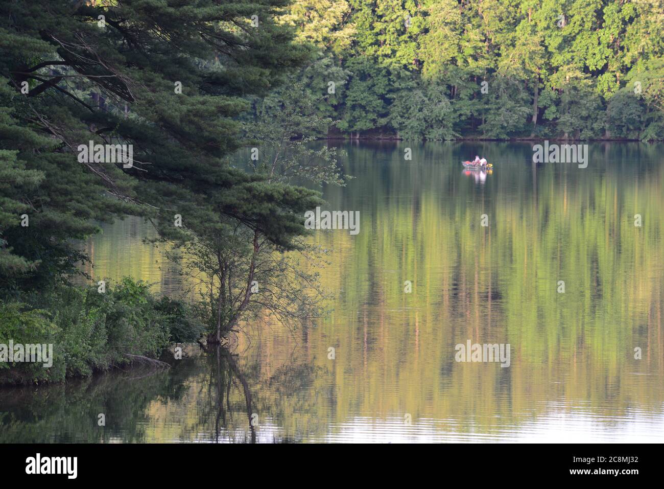 Reflection and boaters on Liberty Reservoir, Maryland USA Stock Photo ...