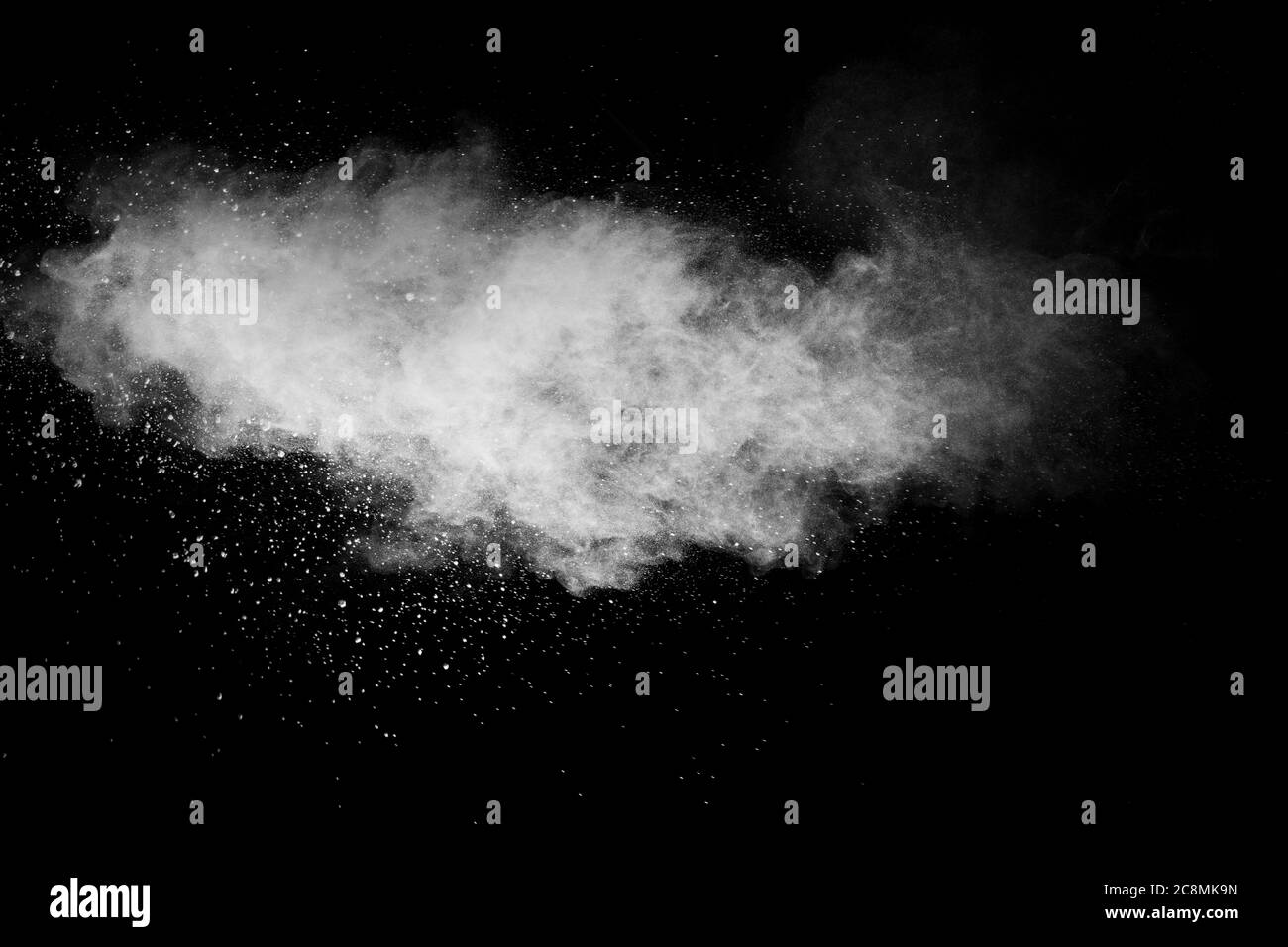 White talcume powder explosion on black background. White dust ...