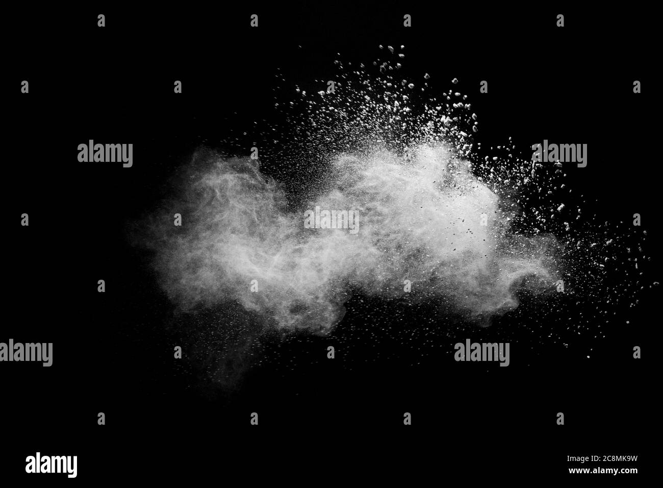 White talcume powder explosion on black background. White dust ...
