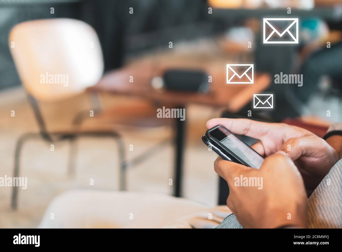 Woman hand using smartphone and it's show email recieve notification ...
