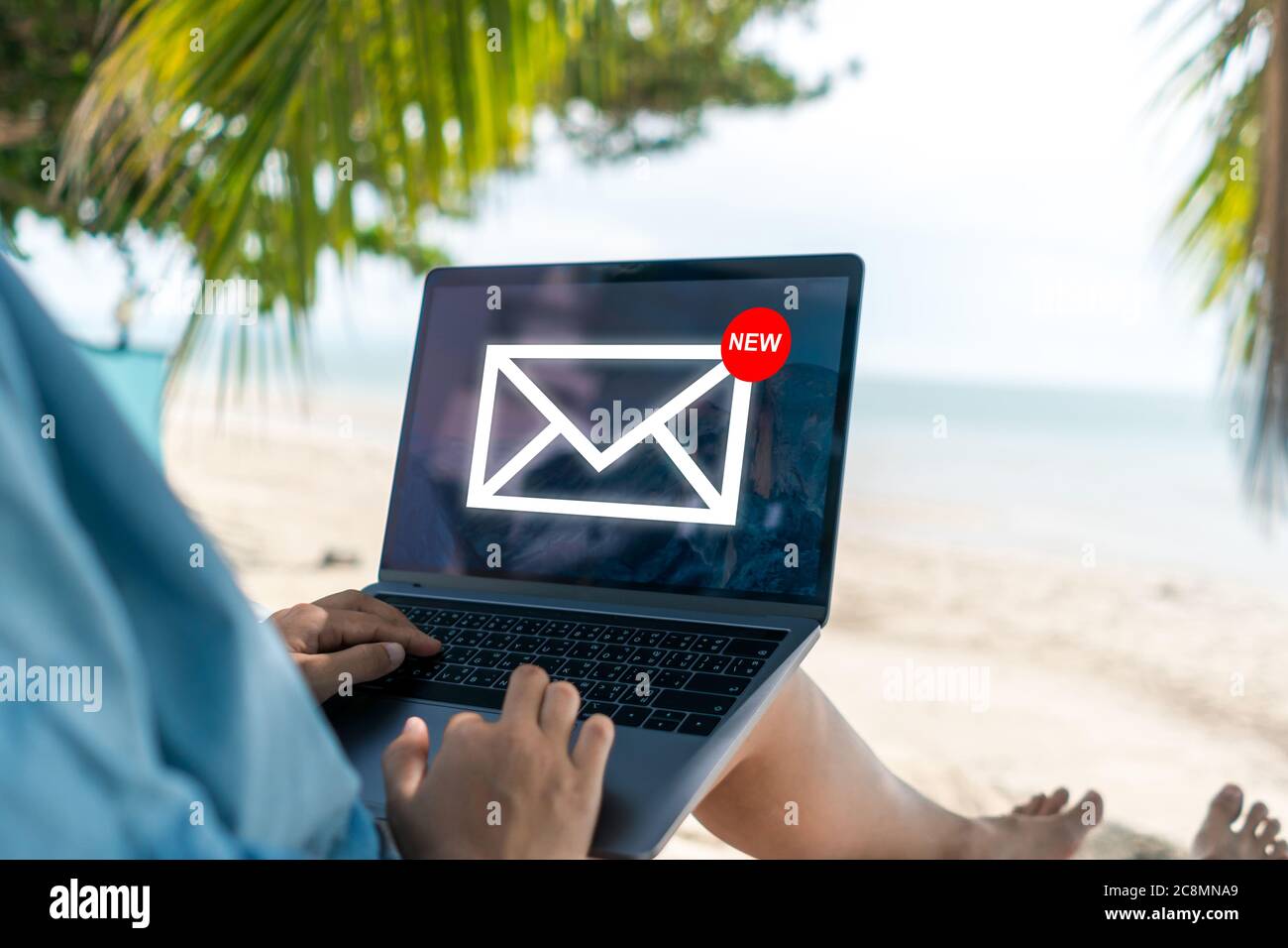 Woman using laptop and it's show email recieve notification icon ...