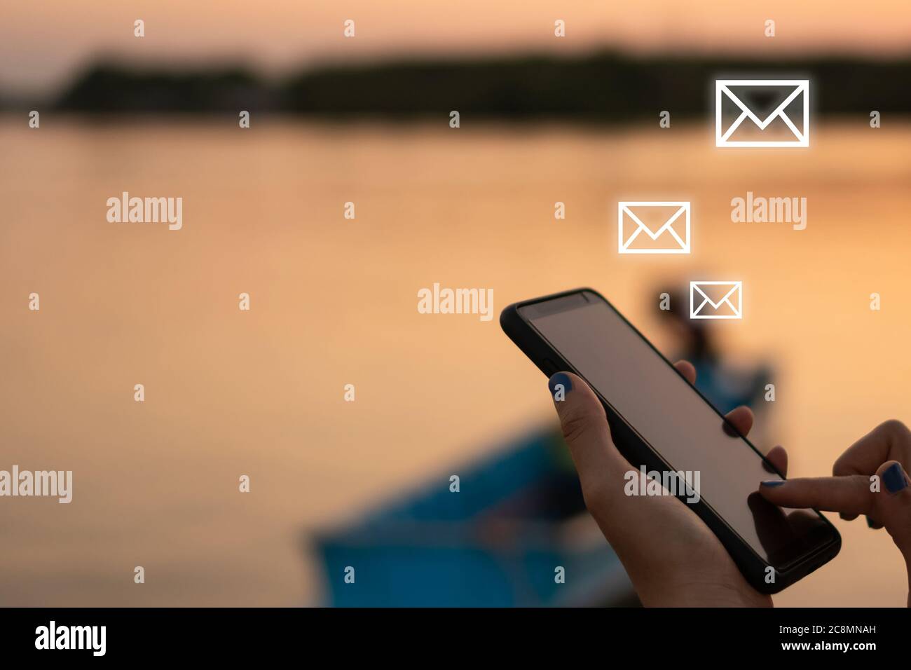 Woman hand using smartphone and it's show email recieve notification ...