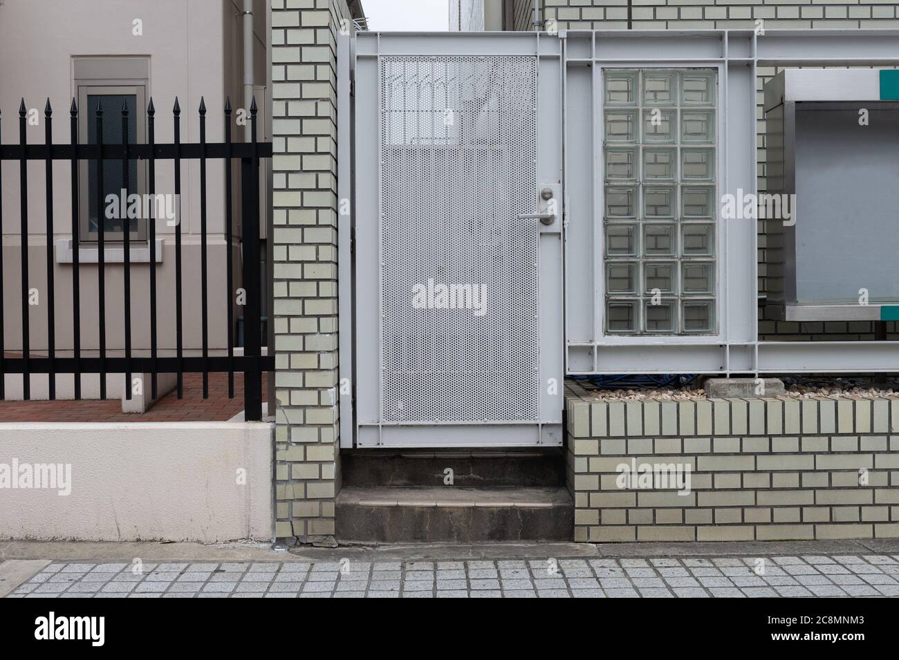 sidewalk by street wall & door Stock Photo - Alamy