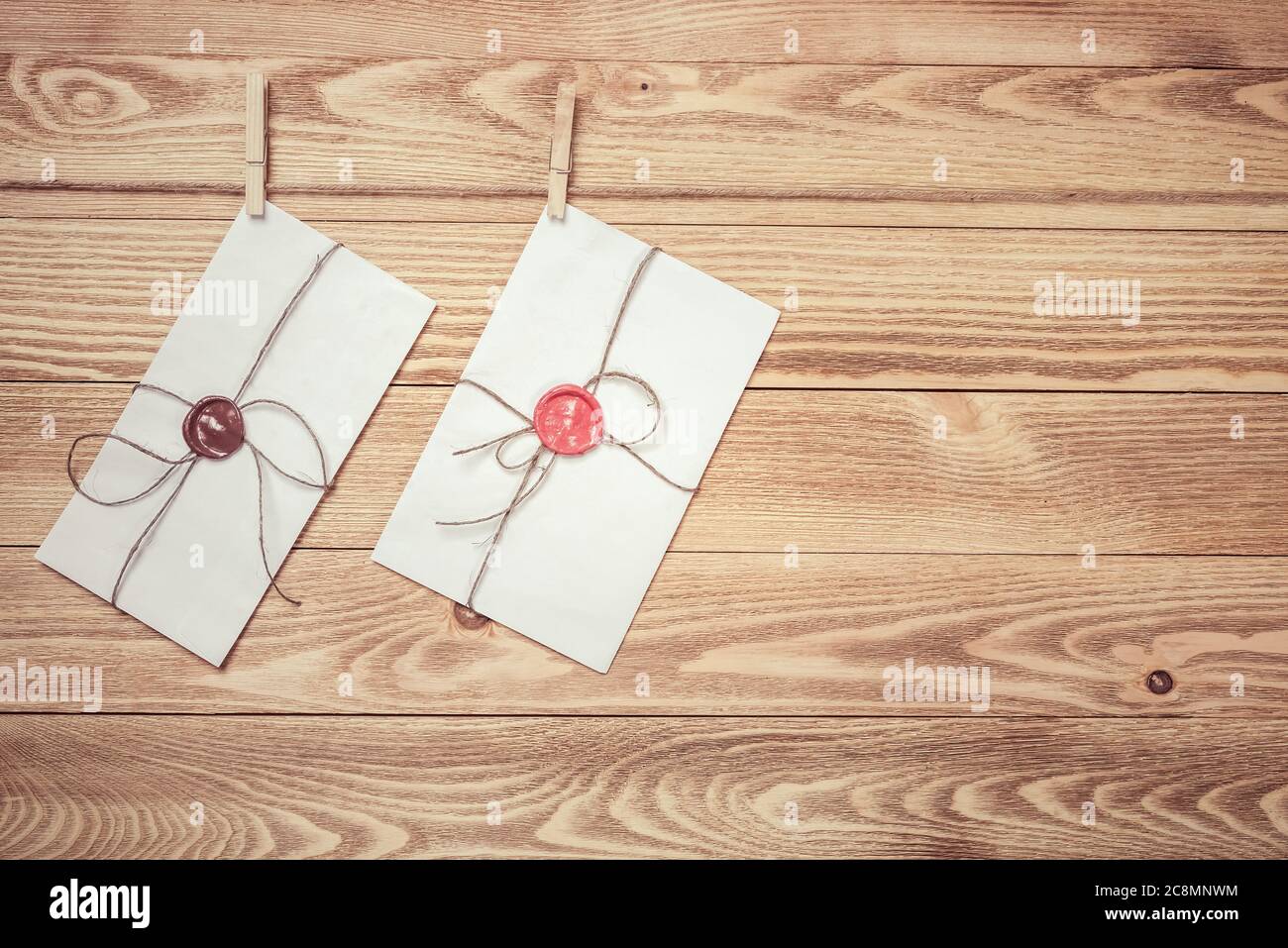 Mail envelope on rope Stock Photo - Alamy