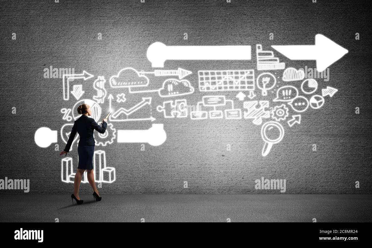 Woman throwing light on her ideas Stock Photo - Alamy