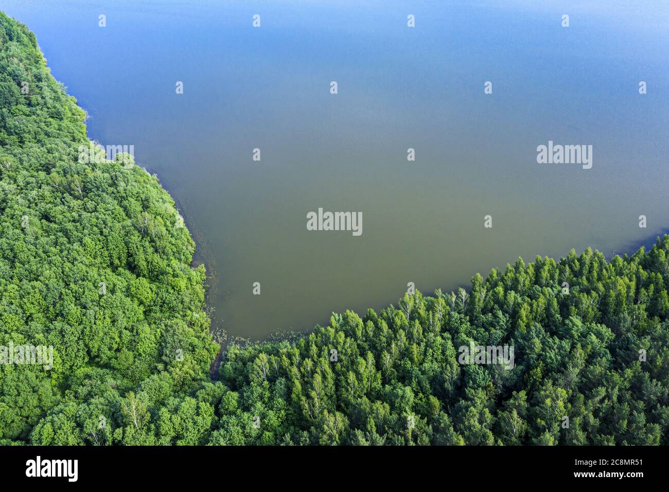 summer landscape view from flying drone of lake with sky reflection and ...