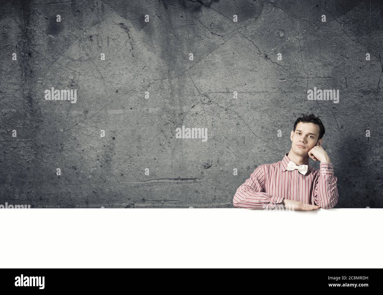 Bored man with banner Stock Photo - Alamy