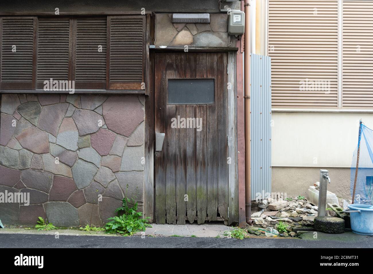 sidewalk by street wall & door Stock Photo - Alamy
