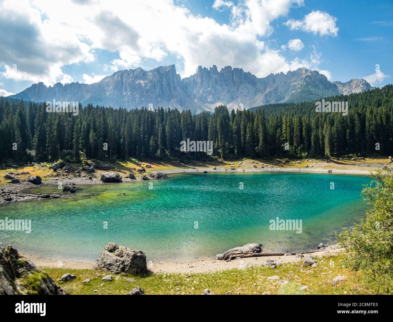 The Karersee below the Karerpass at the foot of the Latemar massif in ...