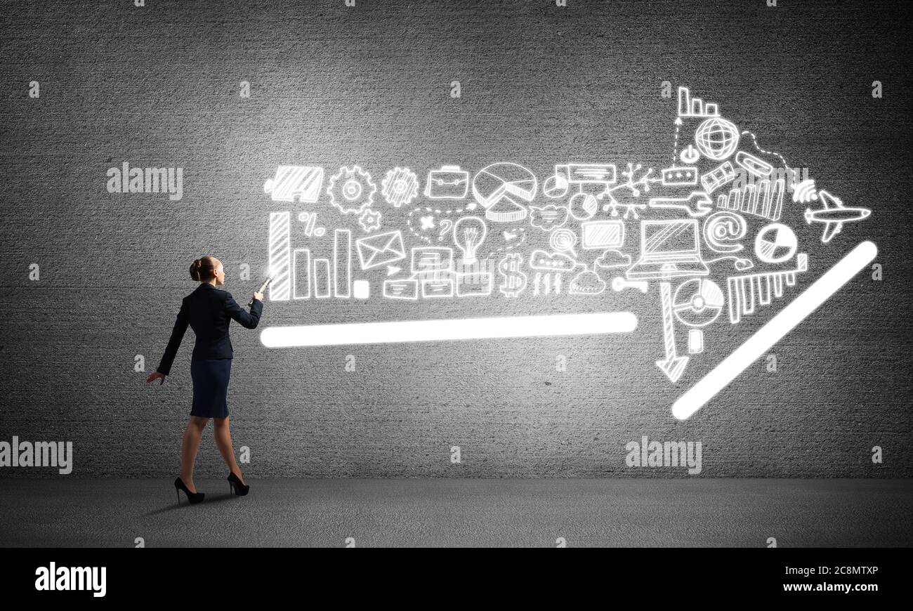 Woman throwing light on her ideas Stock Photo - Alamy