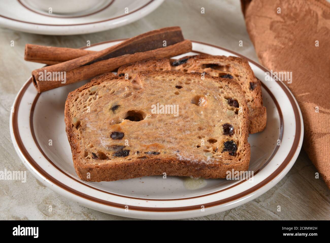 Hot buttered slices of gluten free cinnamon and raisin toast Stock ...