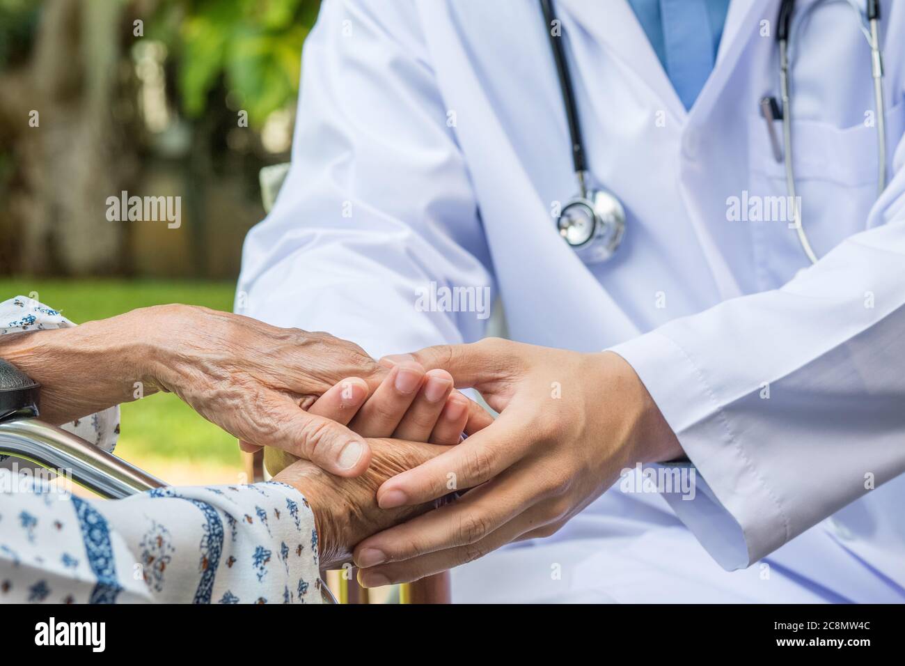 Doctor is encouraging elderly to keep healthy Stock Photo - Alamy