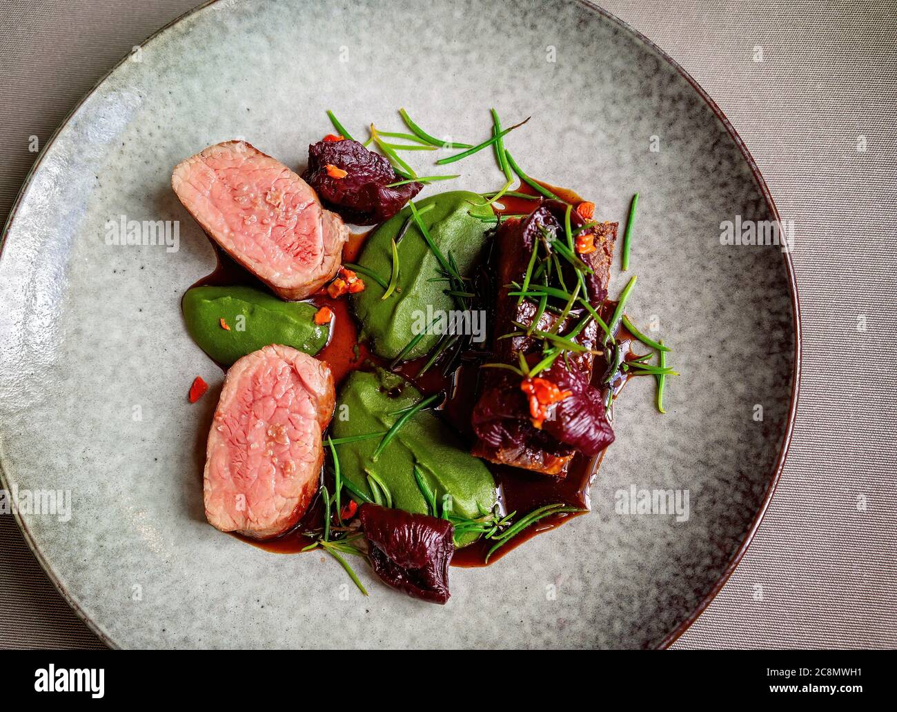 Bush food plate of grass fed beef, warrigal greens, sea fern and ...