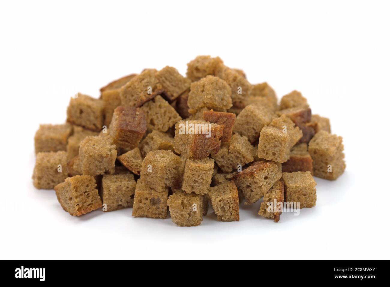 Toasted bread cubes against white background Stock Photo - Alamy