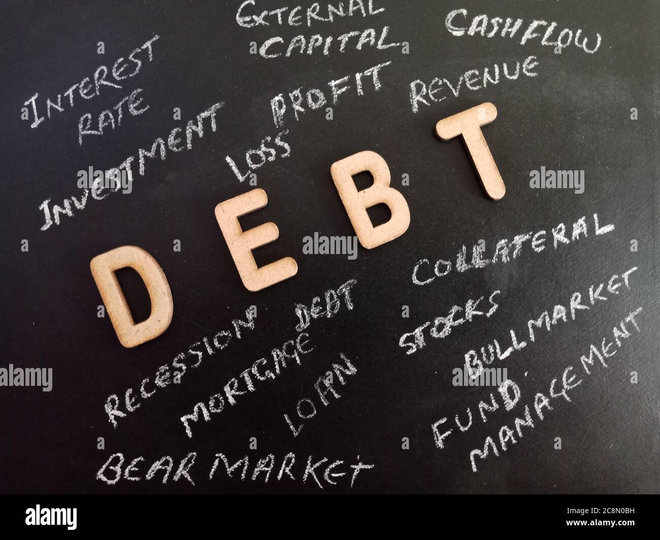 Debt text displayed on black board with 3d word on dark education ...