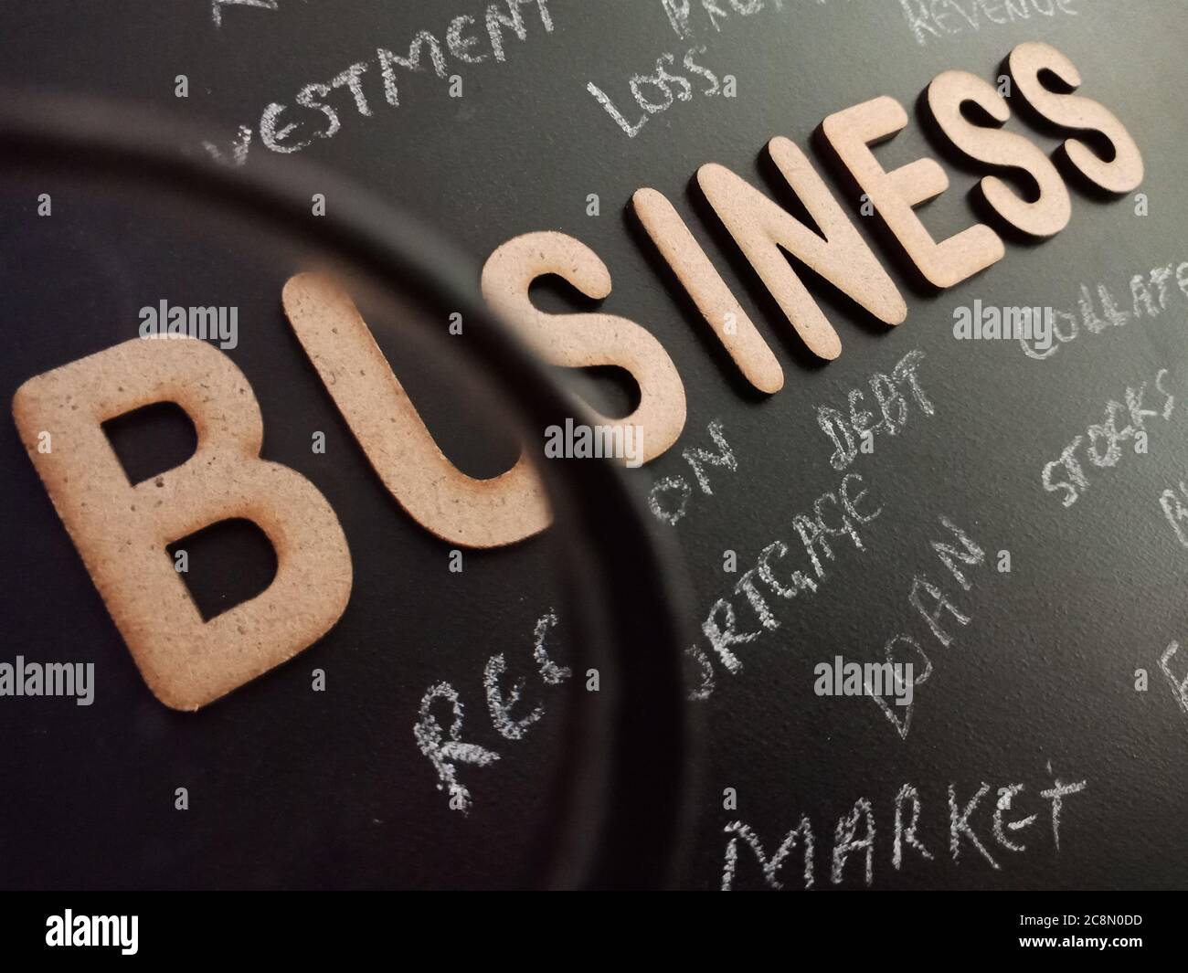 Business word presented on chalk board with wooden alphabets collection ...