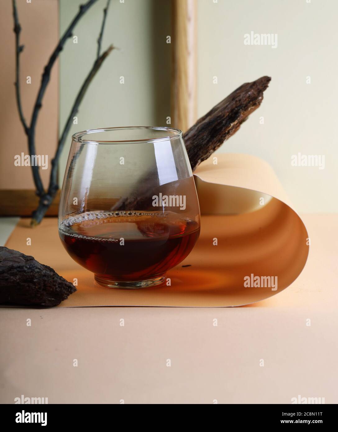 glass with brandy whiskey on natural background Stock Photo - Alamy