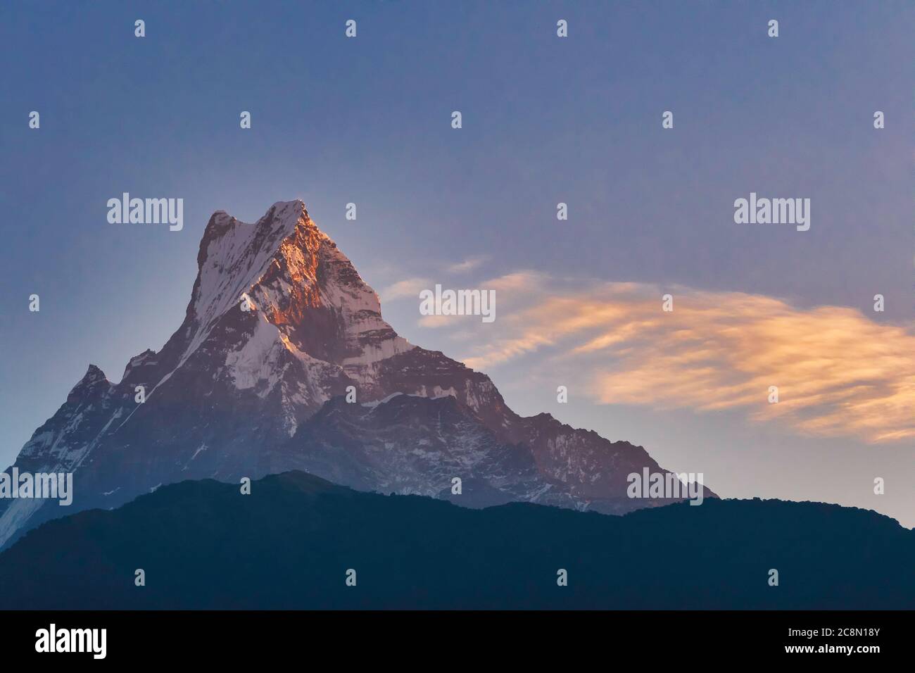 Mount Machhapuchhre or Fishtail in the Himalayas in Nepal.We can see ...