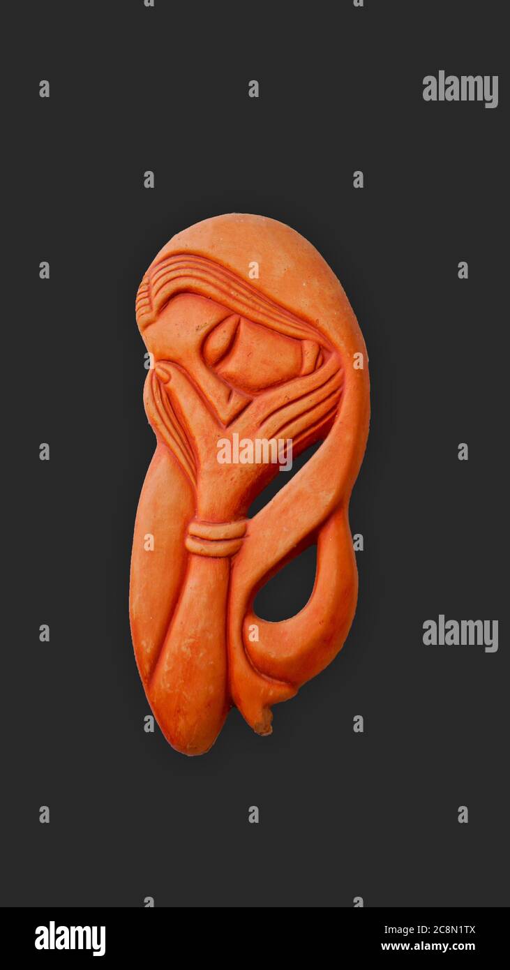 Human Face handicraft made from clay. Natural terracotta color ...