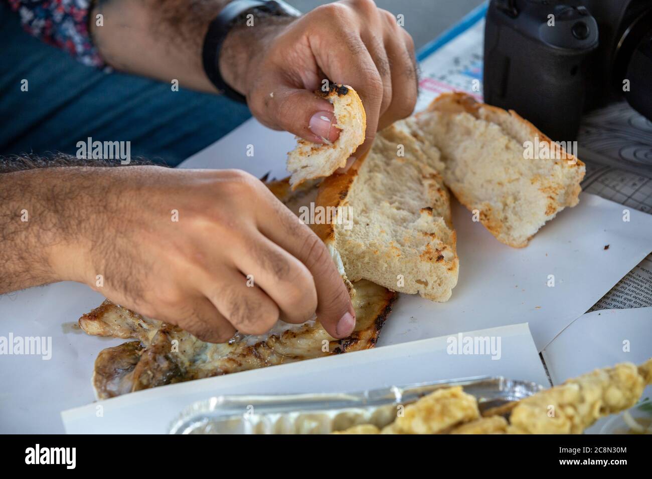 Man eating fish hi-res stock photography and images - Alamy
