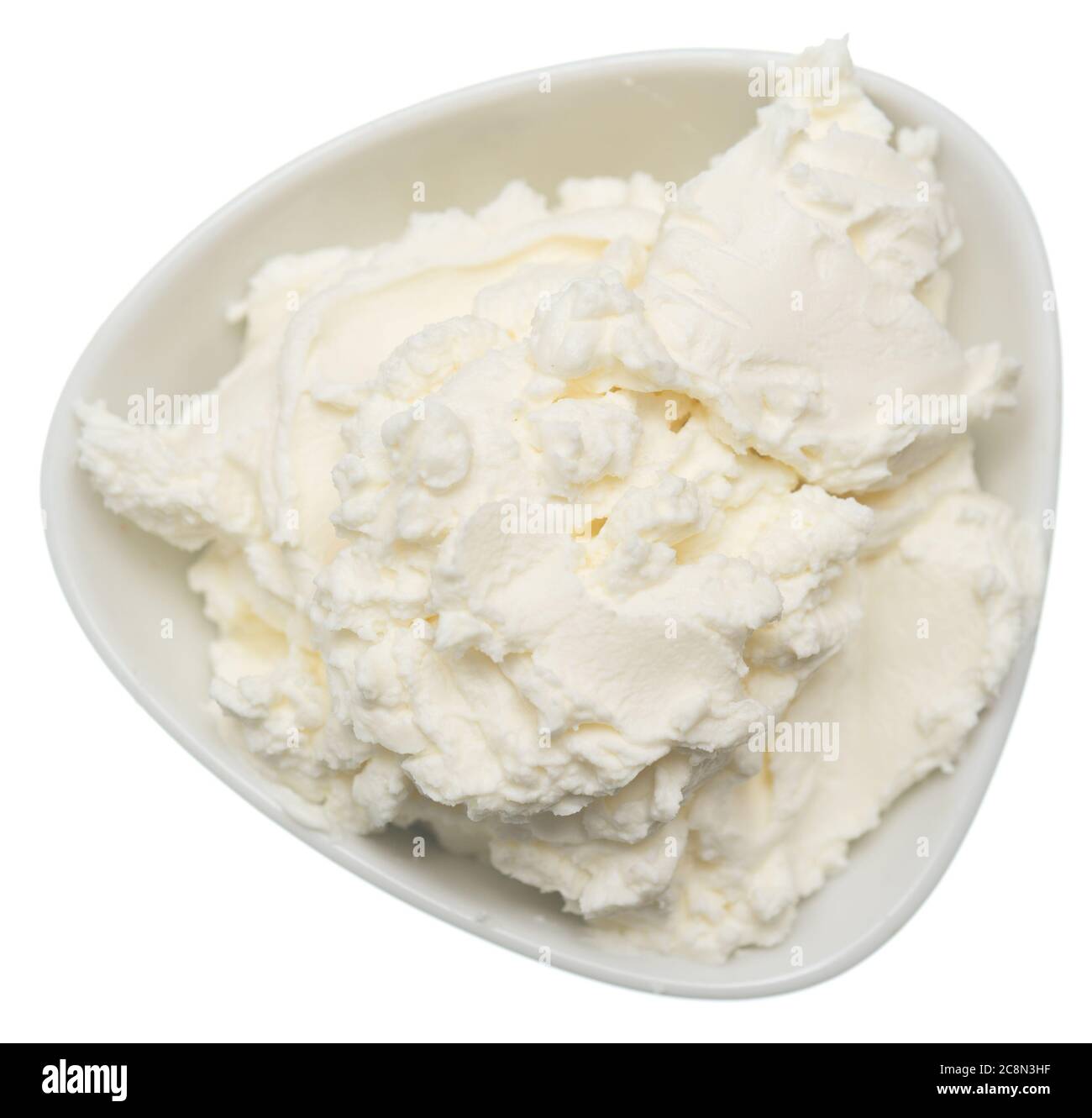 Cream cheese in bowl isolated on white background Stock Photo - Alamy