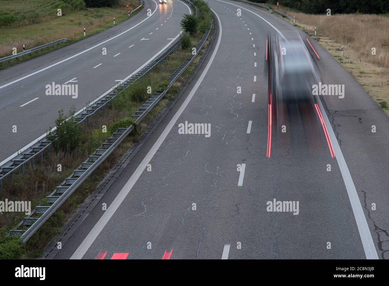 German autobahn in the evening with the light trails of traffic Stock ...