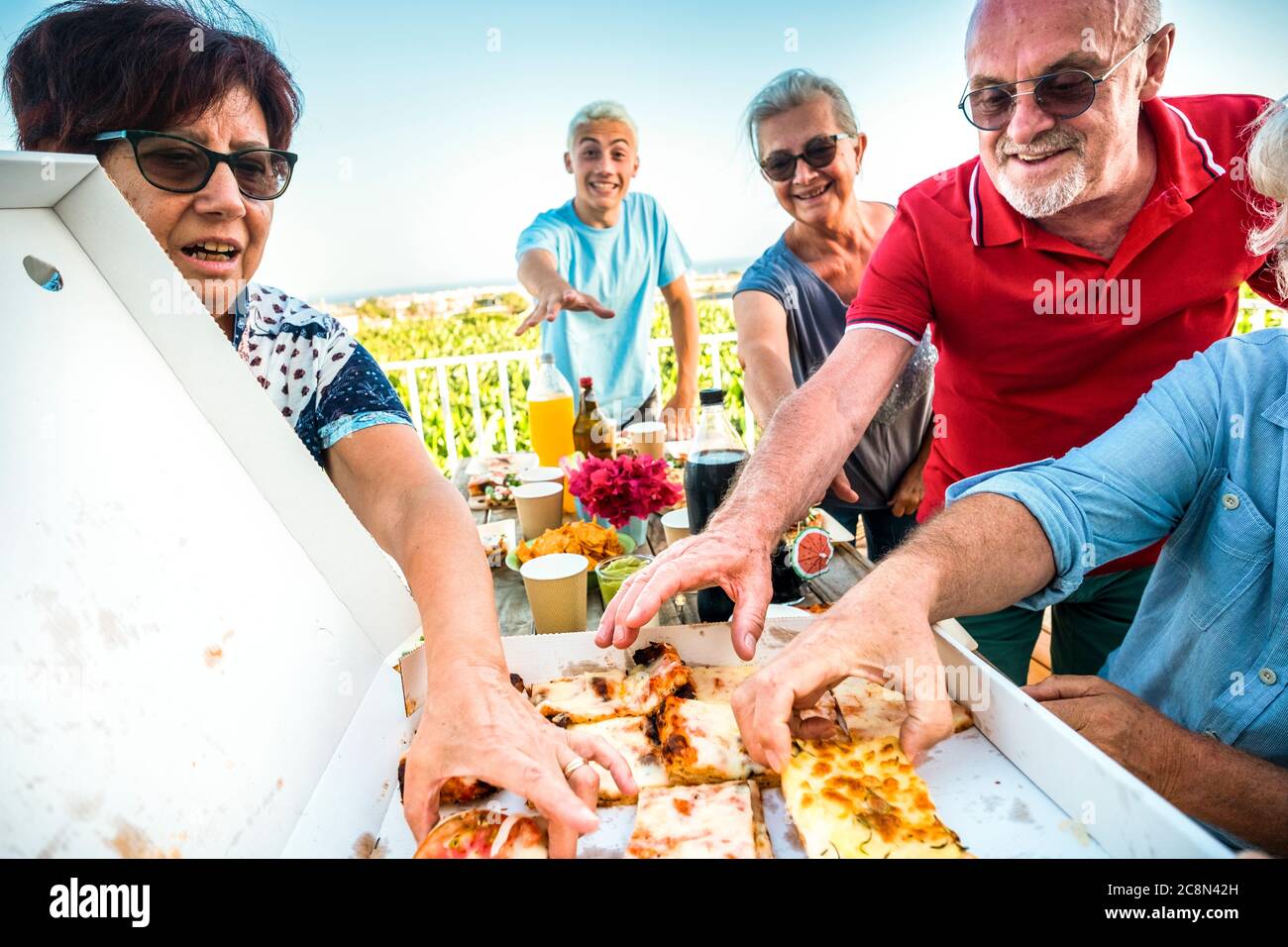 Group of cheerful friends have fun together in friendship taking and ...