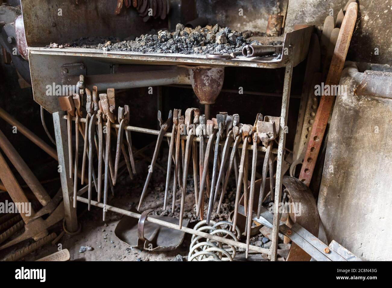 Forge with a hearth and old tools in a workshop Stock Photo - Alamy