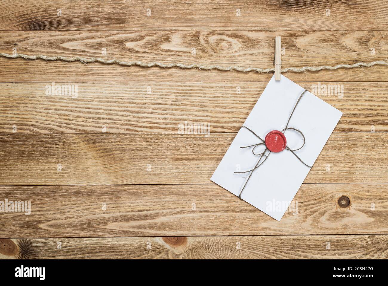 Mail envelope on rope Stock Photo - Alamy
