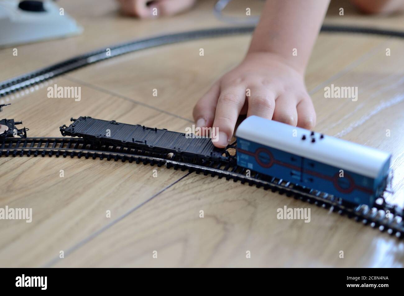 Miniature toy train, cars with child hand and metal rails, scale 1:120 ...