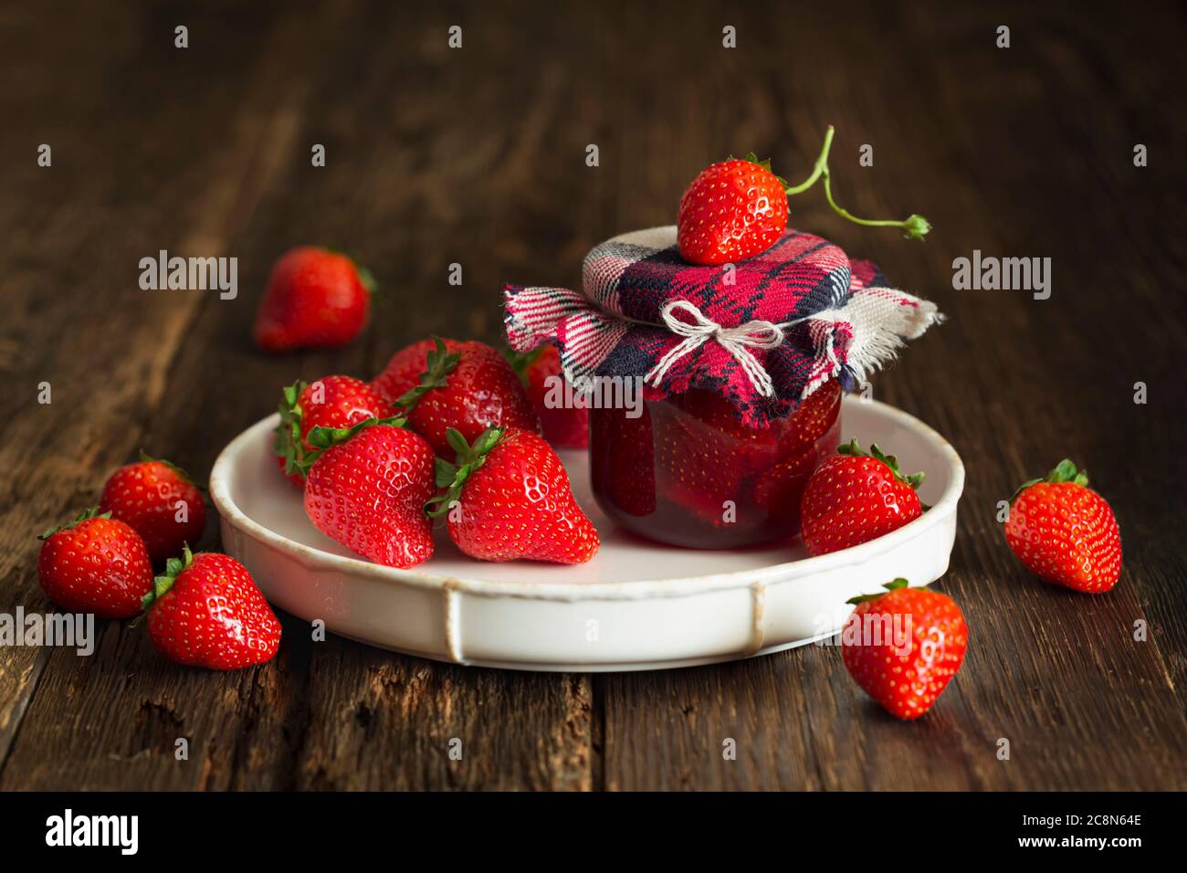 Natural strawberry jam on a rustic table Stock Photo - Alamy