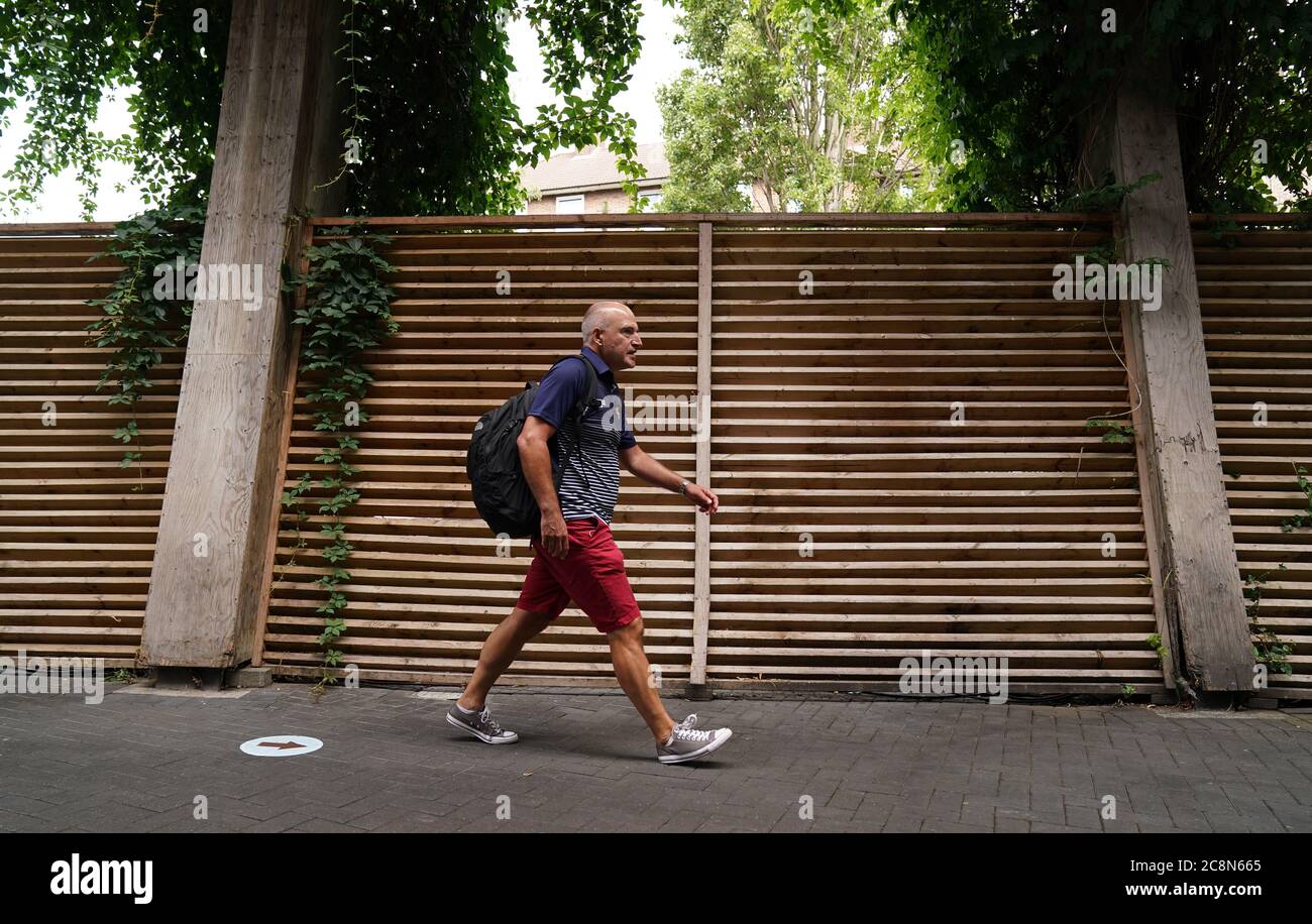 A spectator arrives for the friendly match at the Kia Oval, London ...