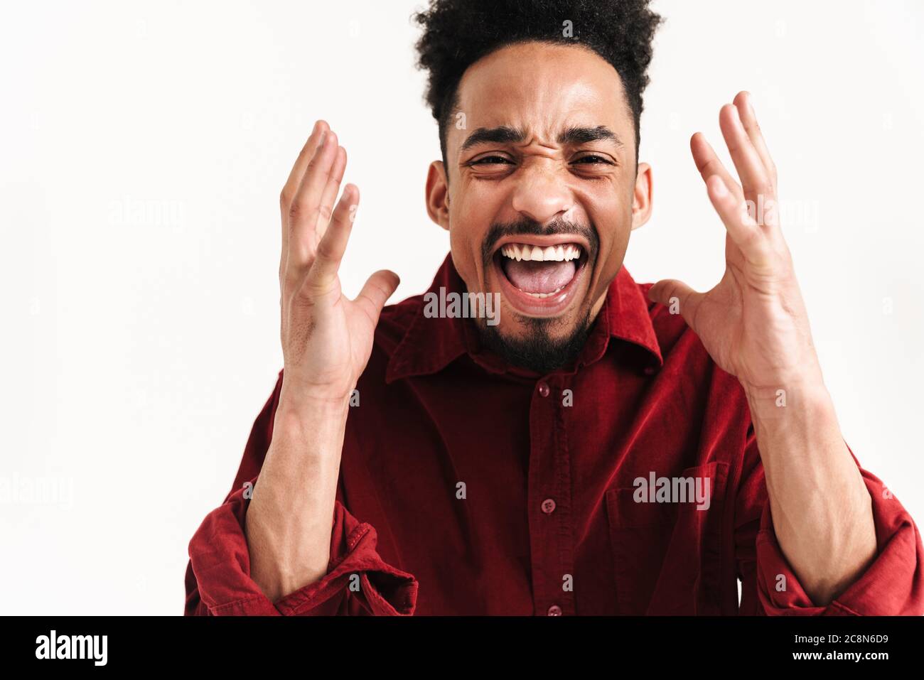 Photo of screaming emotional handsome african young man posing isolated ...
