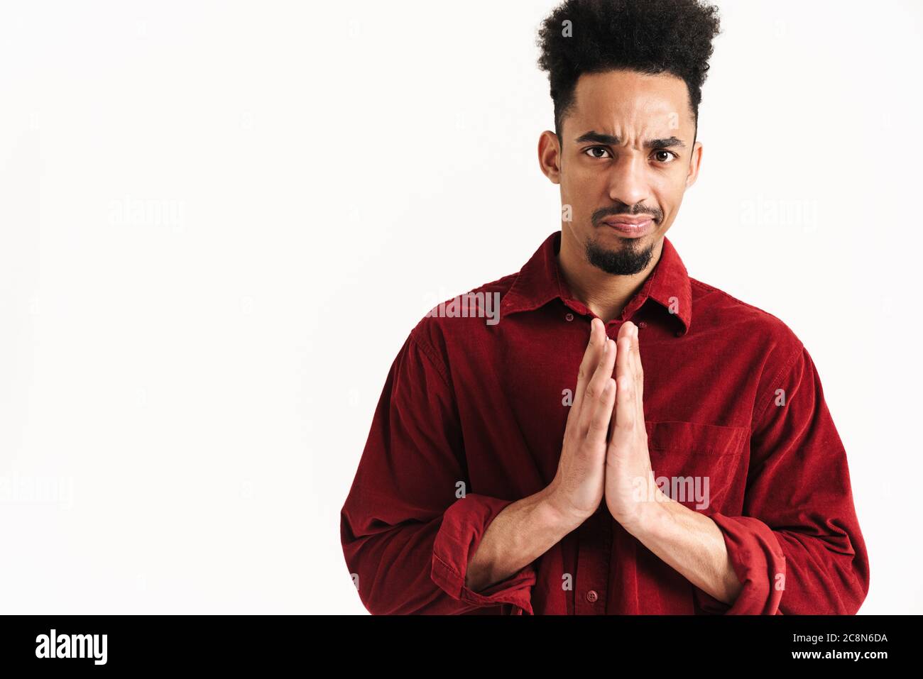 Image of unsured displeased handsome african young man posing isolated ...