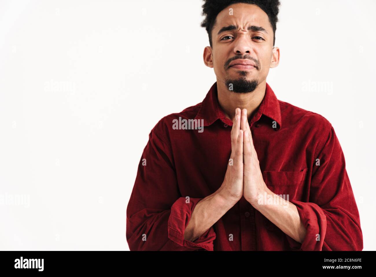 Photo of hopeful african young man posing isolated over white wall ...