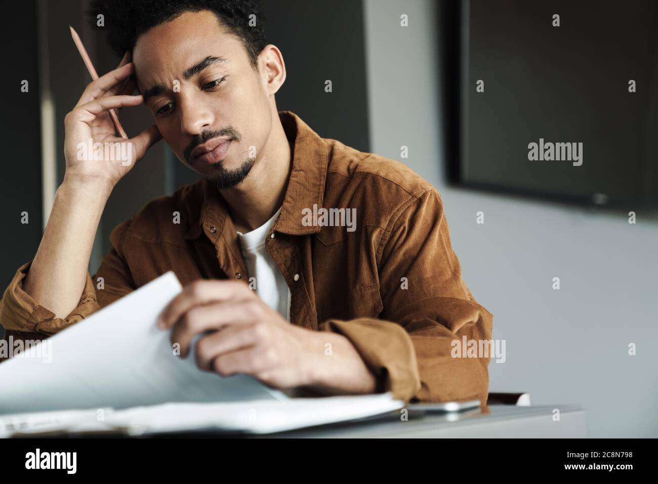 Serious good looking man working hi-res stock photography and images ...