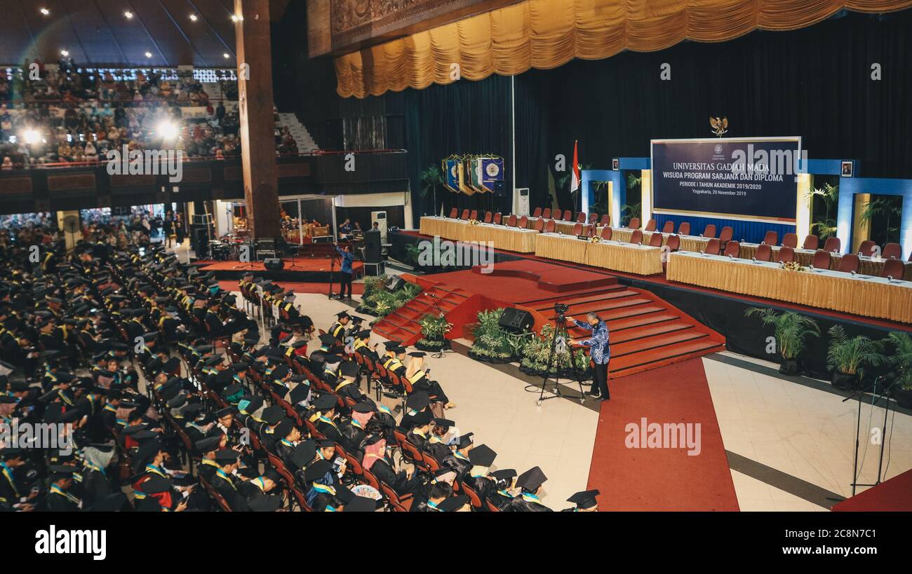 Top view of group of university graduates in black gowns lines up for ...