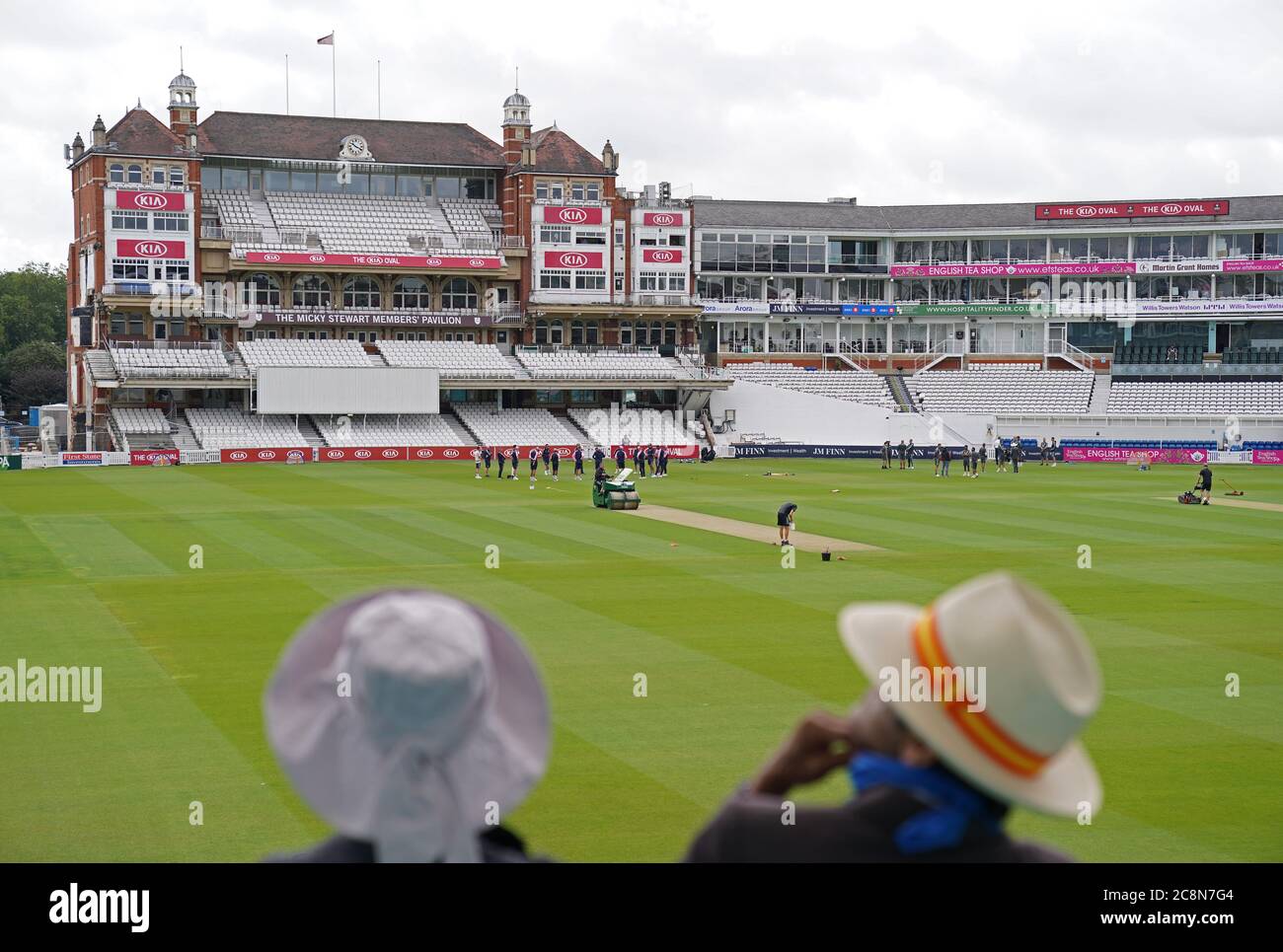Spectators their seats as players warm up before the friendly match at ...