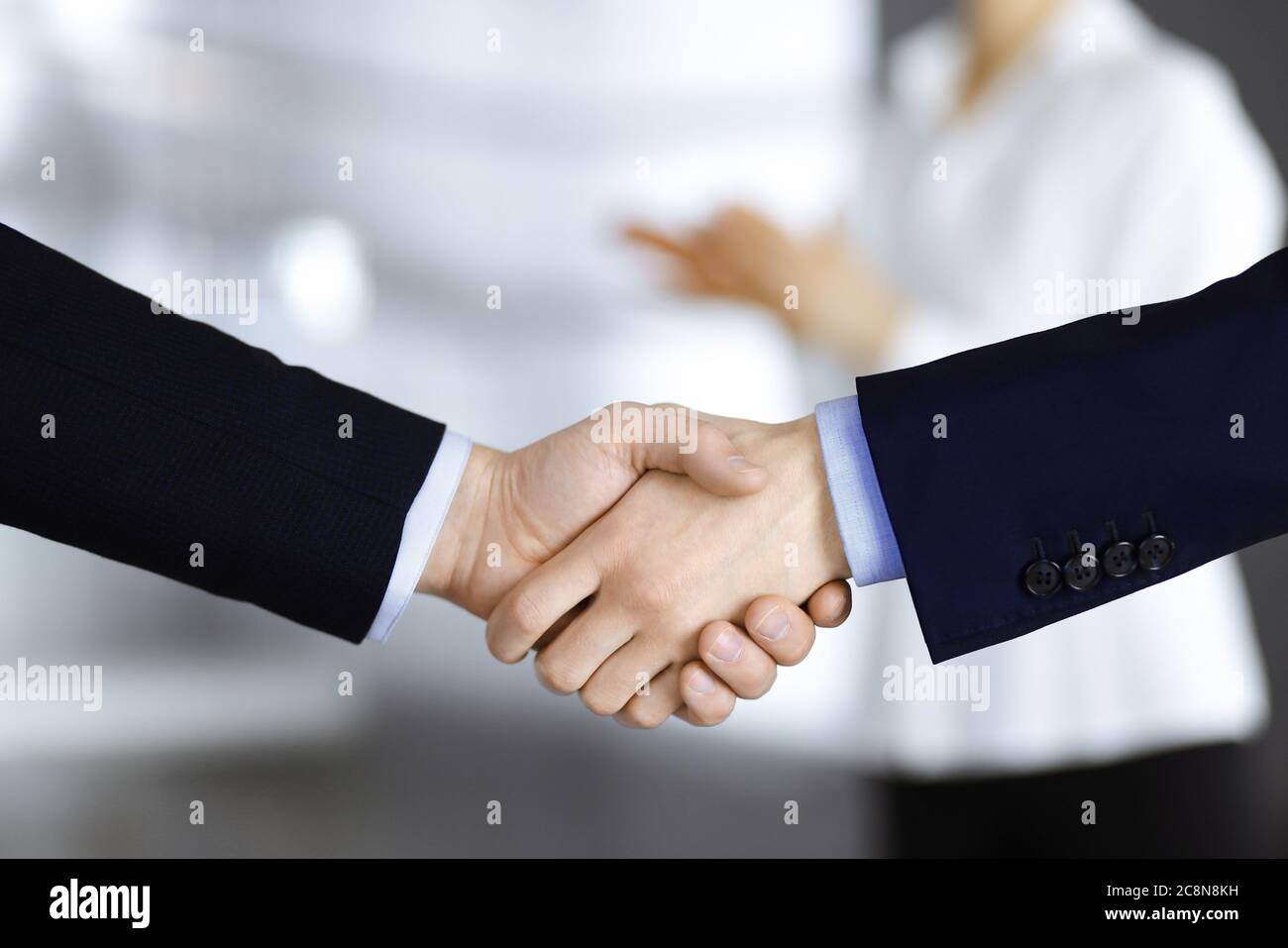 Business people shaking hands at meeting or negotiation, close-up ...