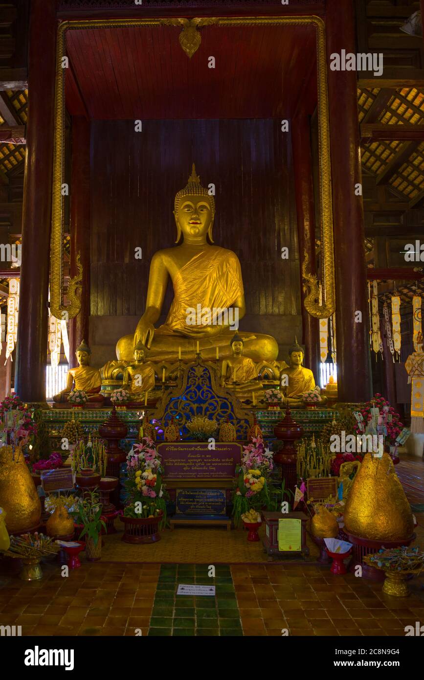 CHIANG MAY, THAILAND - DECEMBER 19, 2018: Altar with a sculpture of a ...