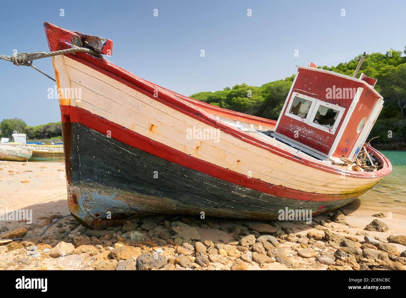 abandoned and sunken fishing boat on the coast of Cadiz. Andalusia ...
