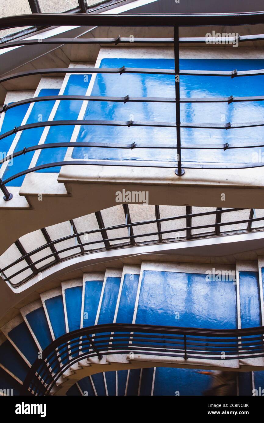 Old blue spiral staircase, spiral stairway inside an old house in ...