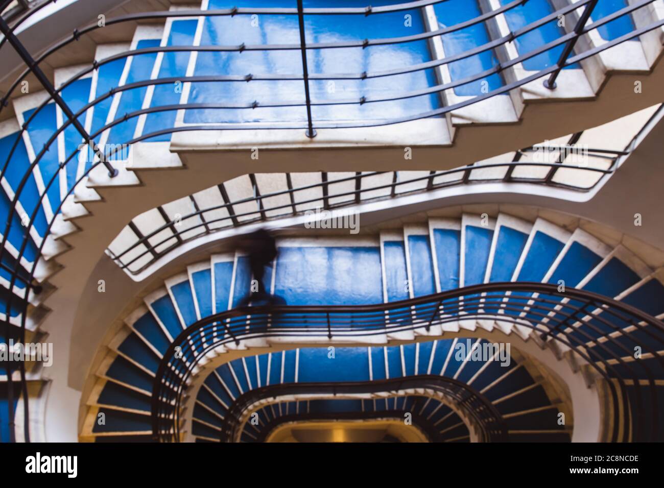 Old blue spiral staircase, spiral stairway inside an old house in ...
