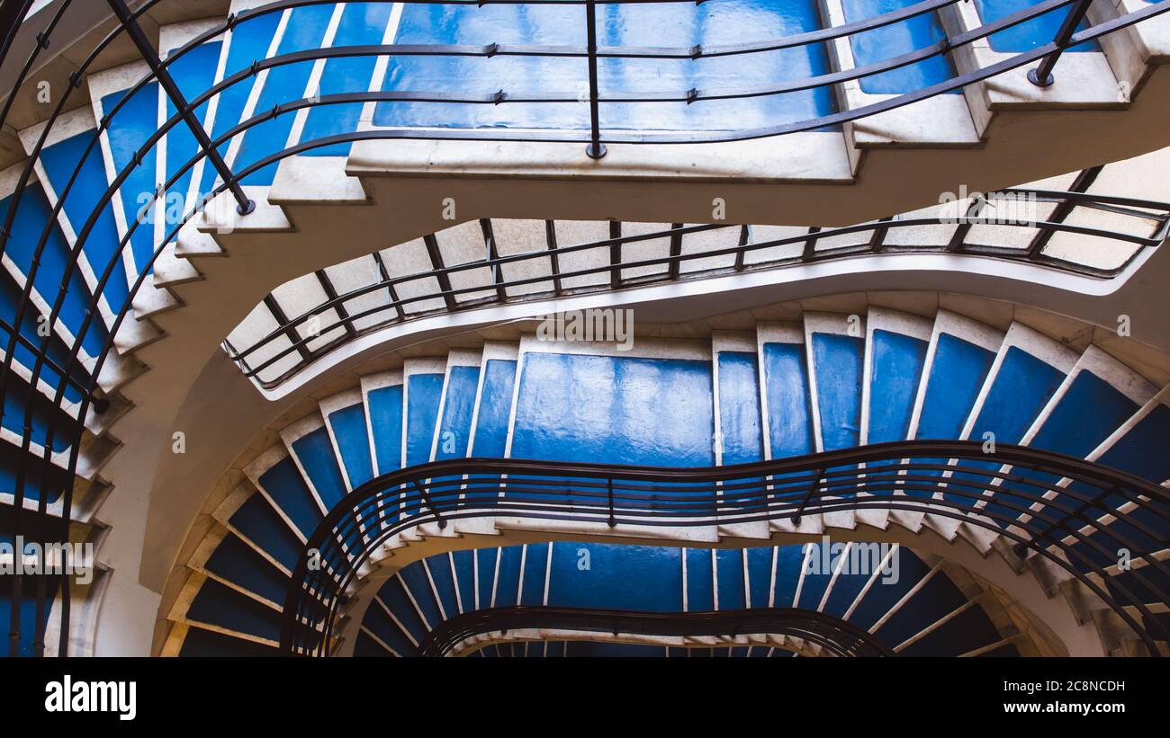 Old blue spiral staircase, spiral stairway inside an old house in ...