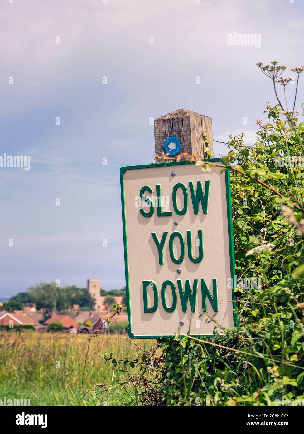 Local Norfolk Slow You Down sign Stock Photo - Alamy