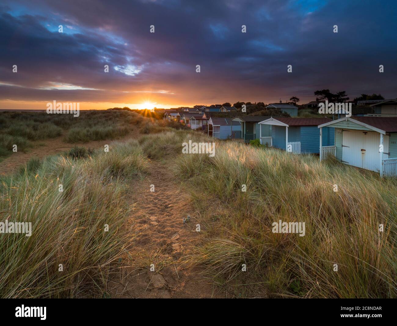 Sunrise over the sand dunes and beach huts of Old Hunstanton Stock ...