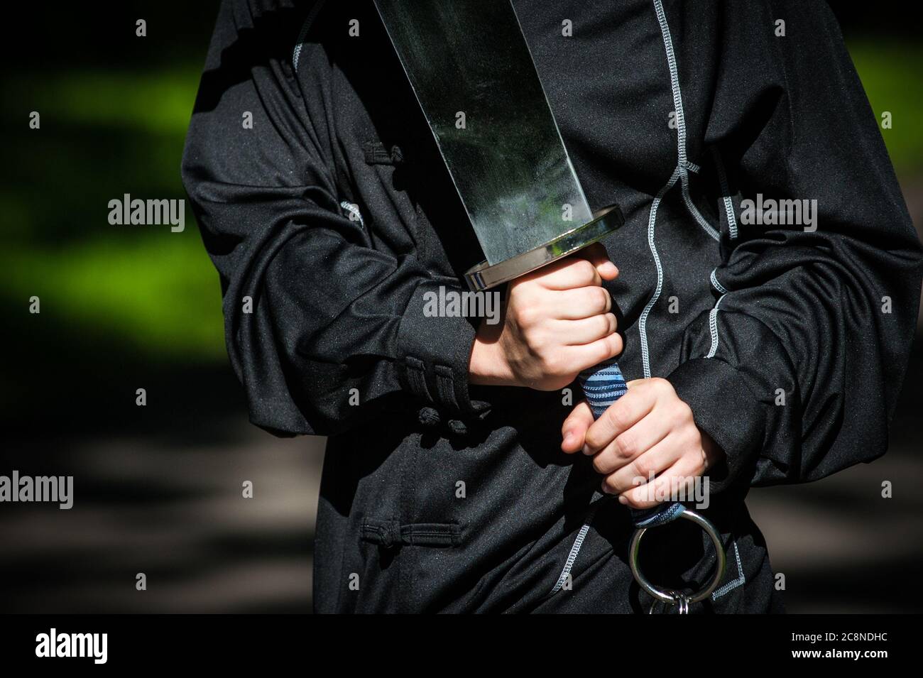kung fu sword is being clamped in human hands Stock Photo - Alamy