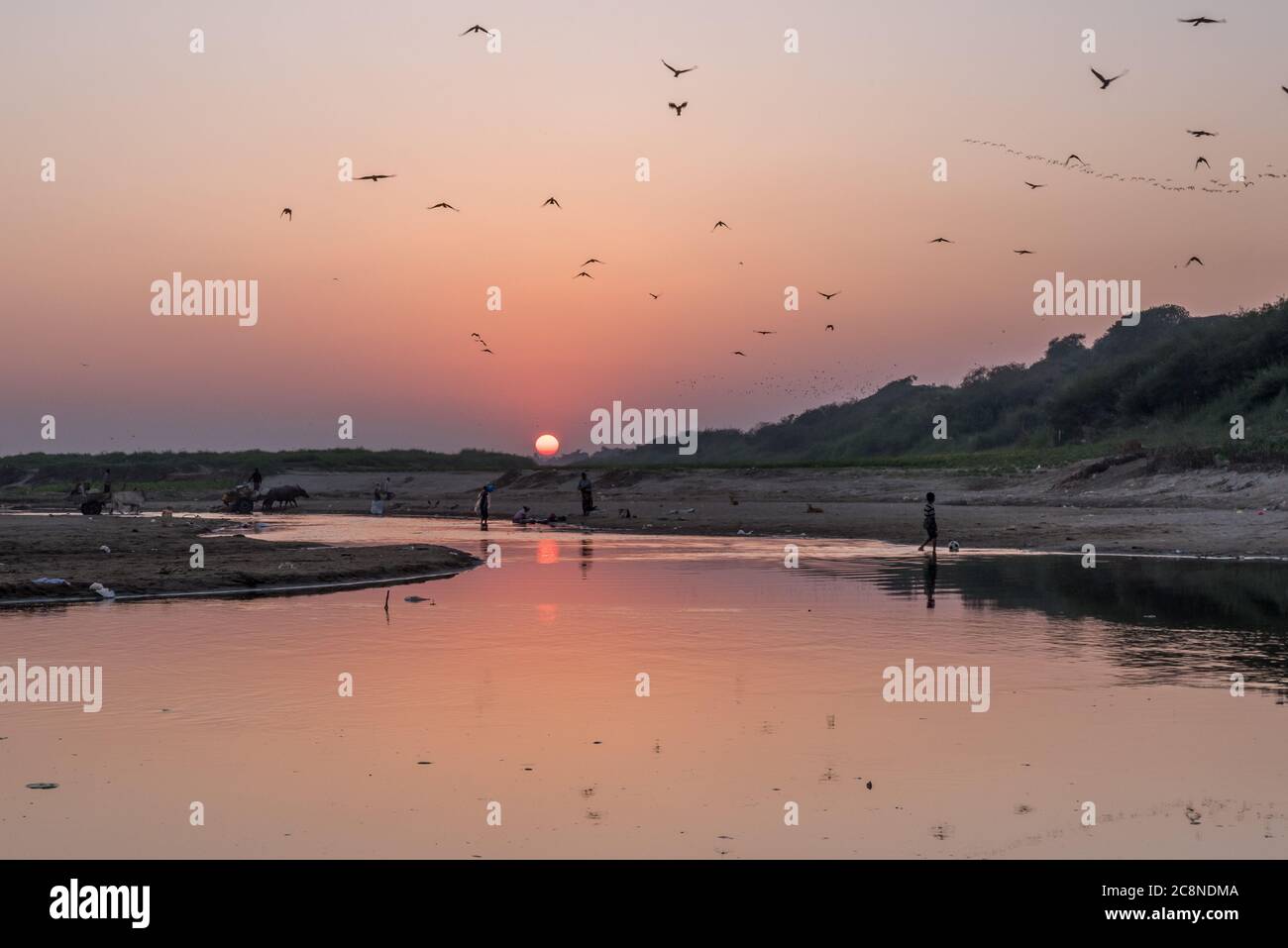 The sun sets on the Irrawaddy River, in Pakokku, Myanmar Stock Photo ...