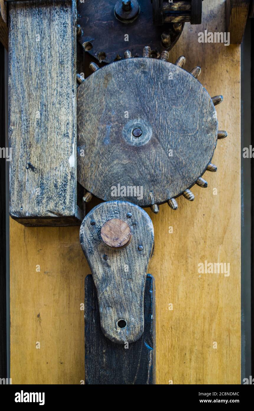 Vintage wooden gears on a wooden background. Photo of ancient mechanics ...