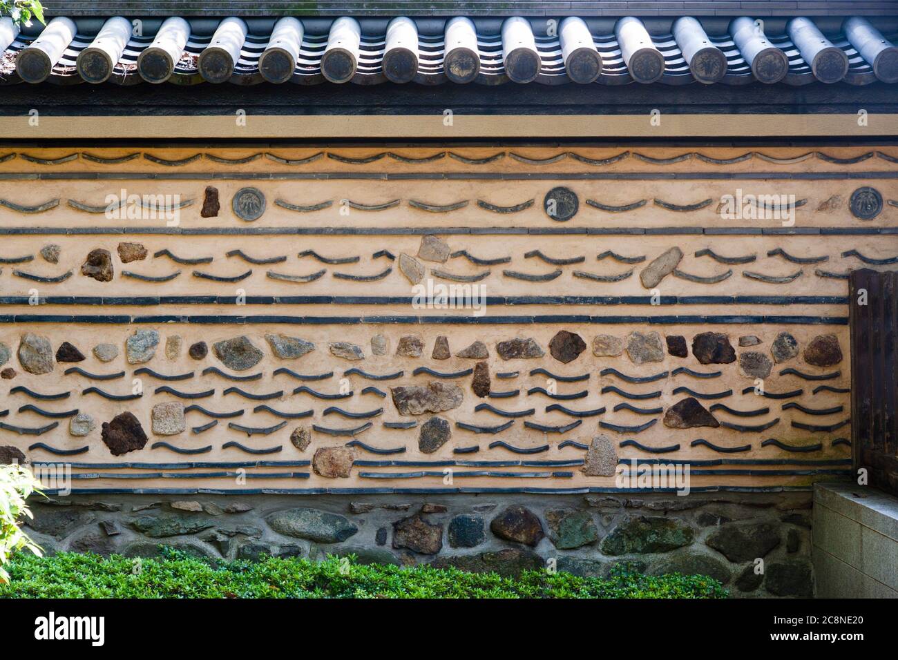 Wall with inlaid stones and tiles, Shofukuji zen temple, Fukuoka, Japan ...